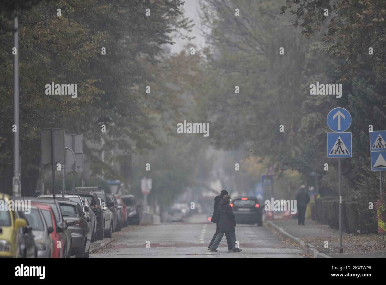 People are seen walking during a smoggy day in Zagreb, Croatia on ...