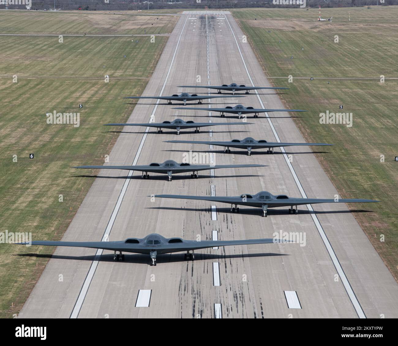B-2 Spirit stealth bombers assigned to Whiteman Air Force Base taxi and ...