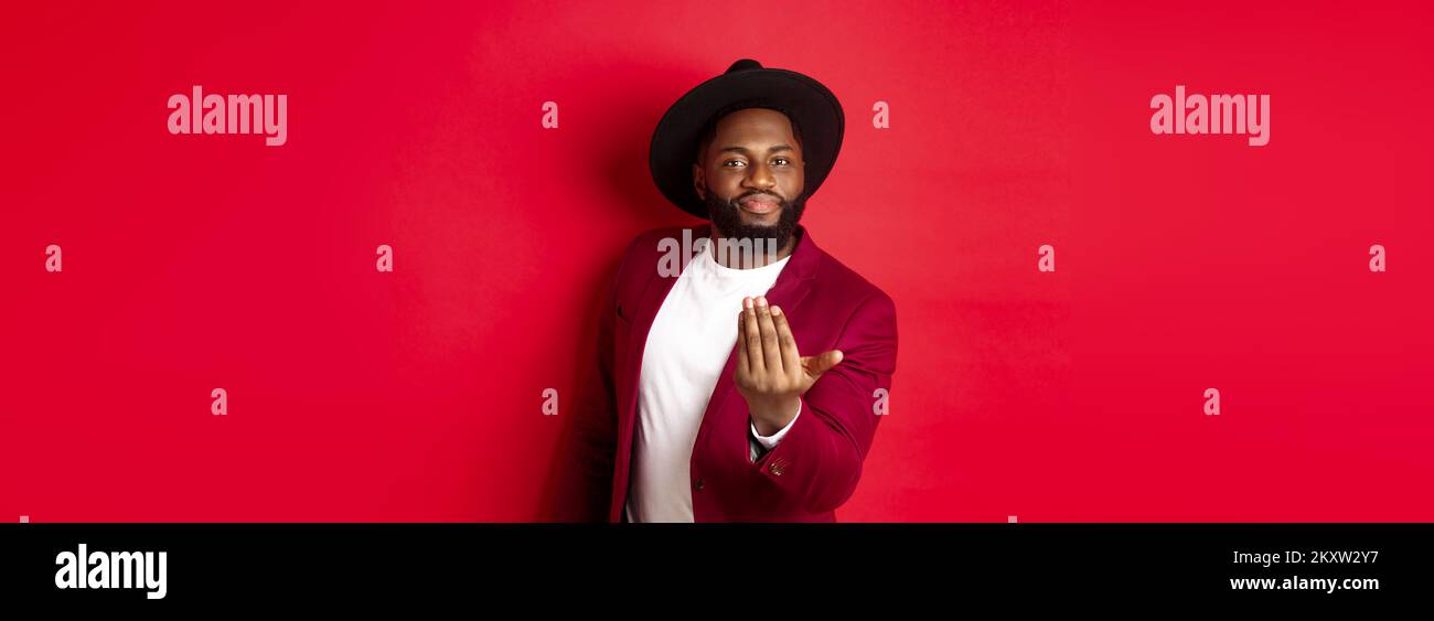 Handsome and masculine Black man asking come closer, luring to step ...