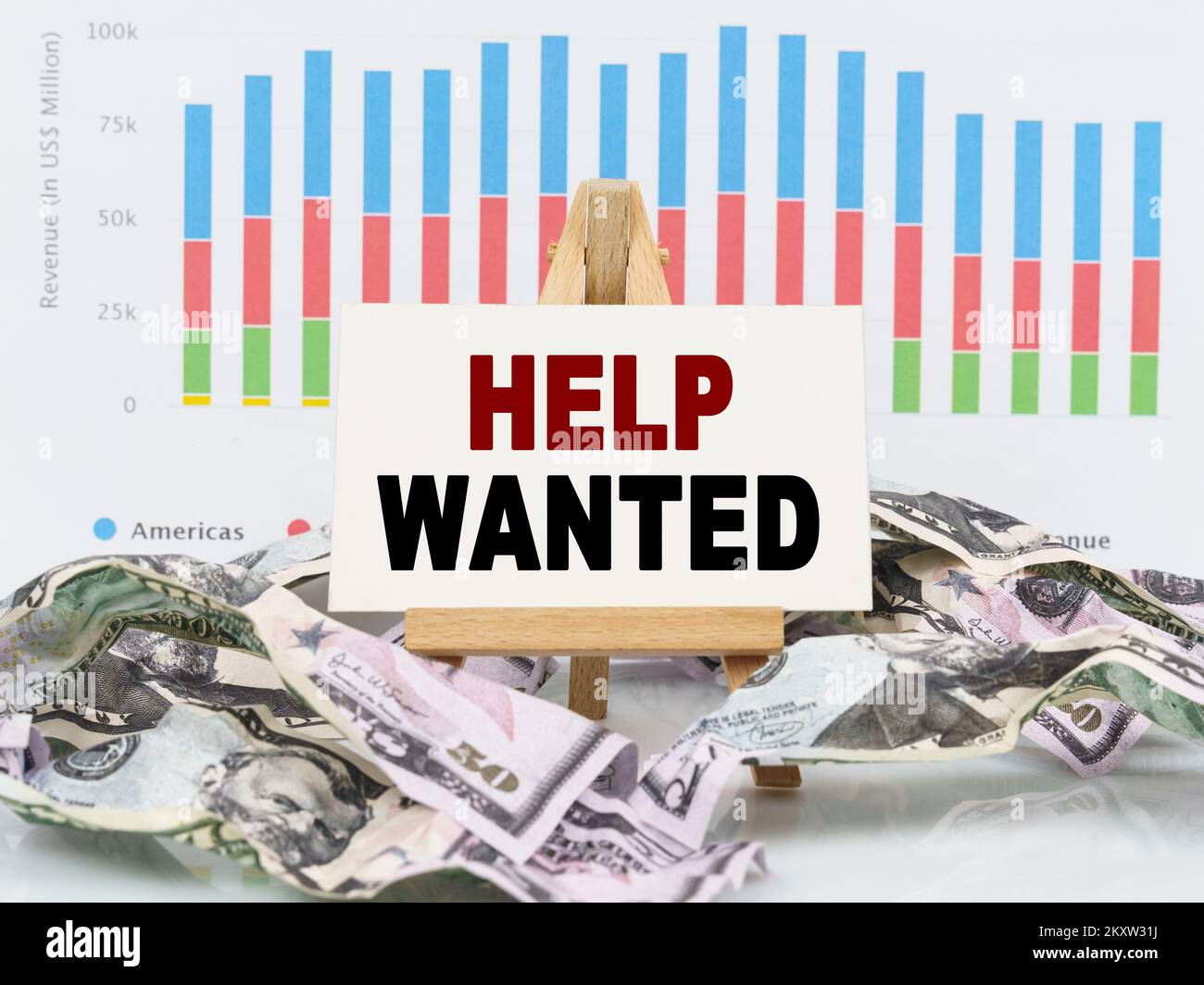 Business and finance concept. Among financial charts and money is a ...