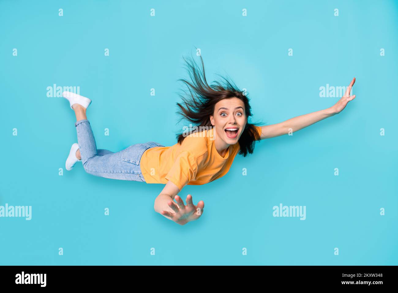 Full length photo of astonished girl impressed open new skills can fly ...