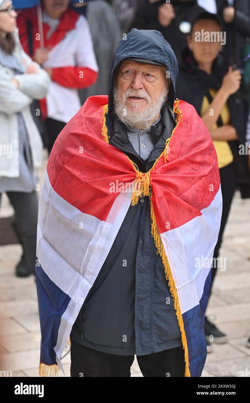 A man wrapped in the Croatian flag at the protests in Zadar, Croatia on ...