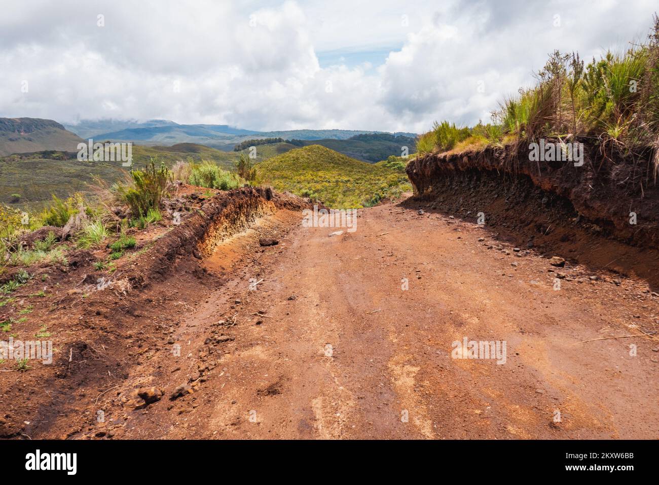A dirt road against a mountain background at Chogoria Route, Mount ...