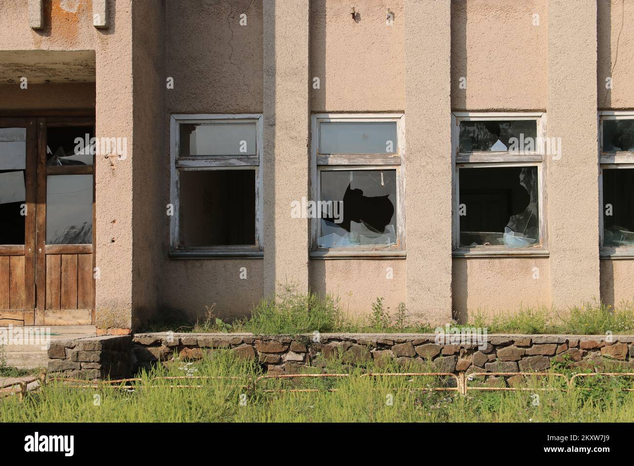 Office building with broken windows Stock Photo - Alamy