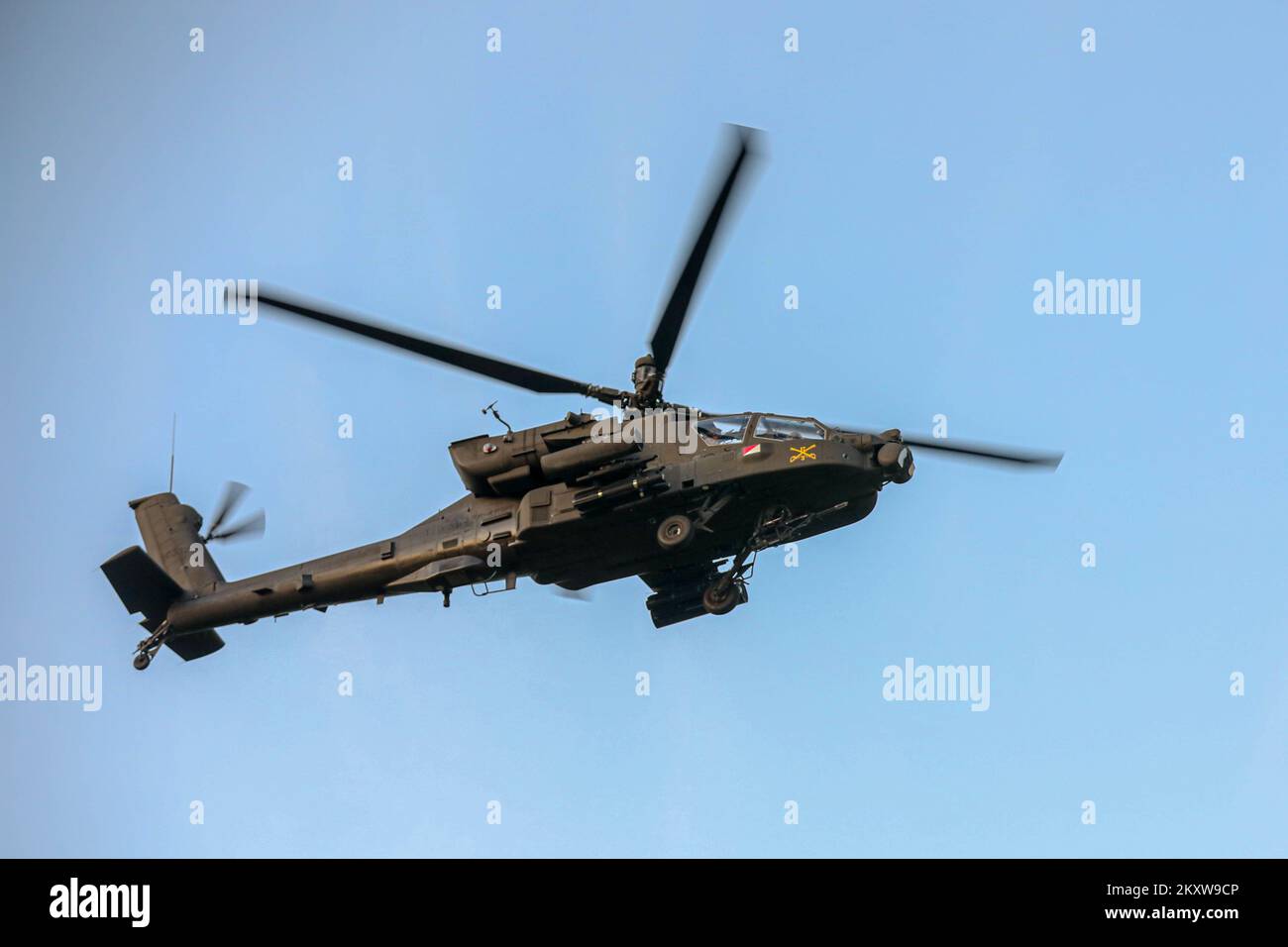 An AH-64 Apache of the 3rd Combat Aviation Brigade conducts a fly-by at ...