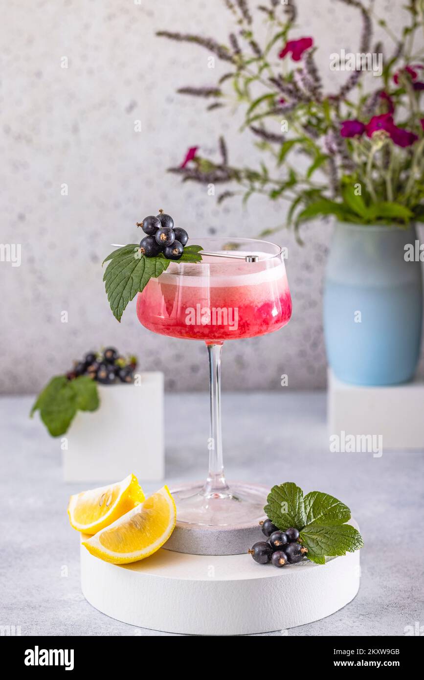 Elegant glass of Black Currant Gin Sour cocktail or mocktails ...