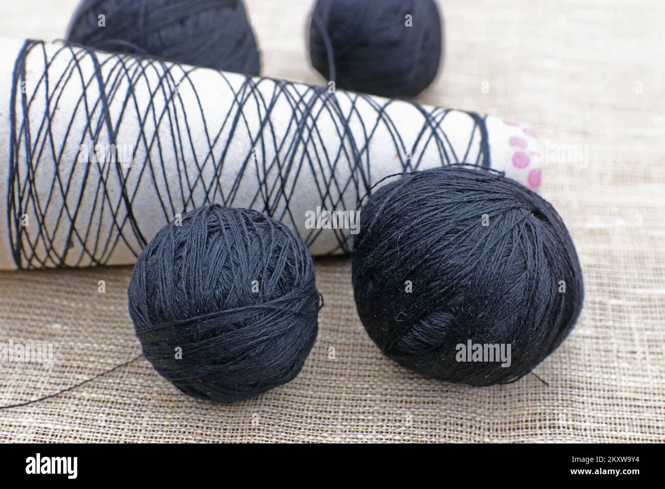 Balls of thread for knitting and an empty spool of thread Stock Photo ...