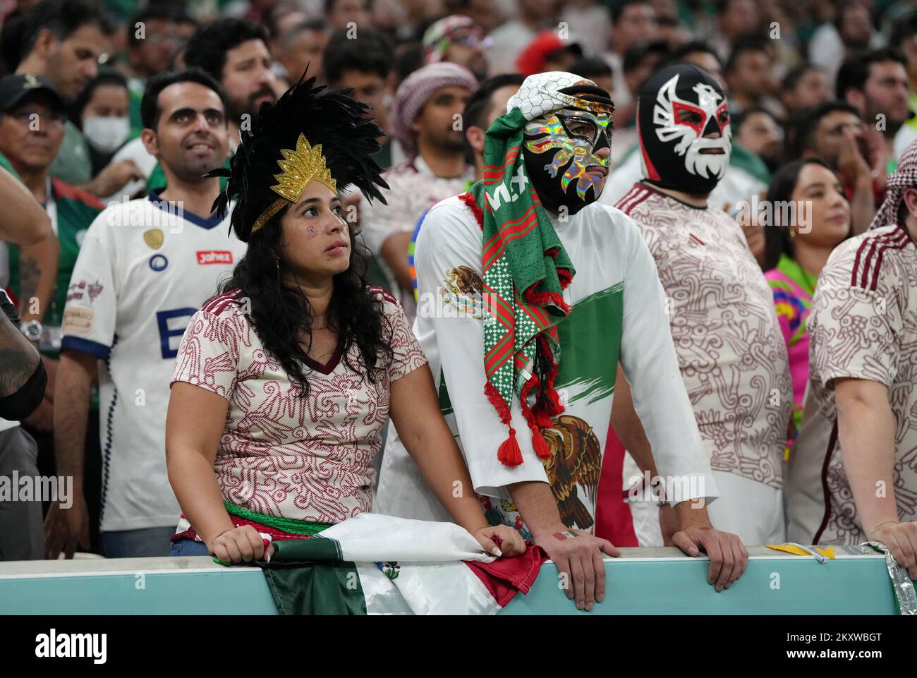 Mexico fans appear dejected in the stands towards the end of the game ...