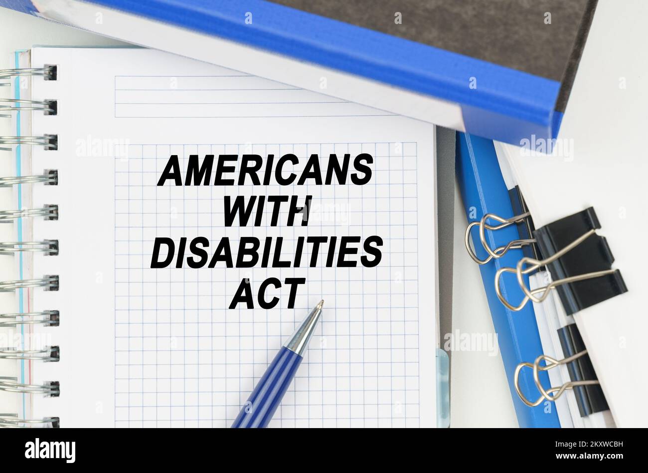 Business and Economics. Among the documents, folders, a notebook with ...