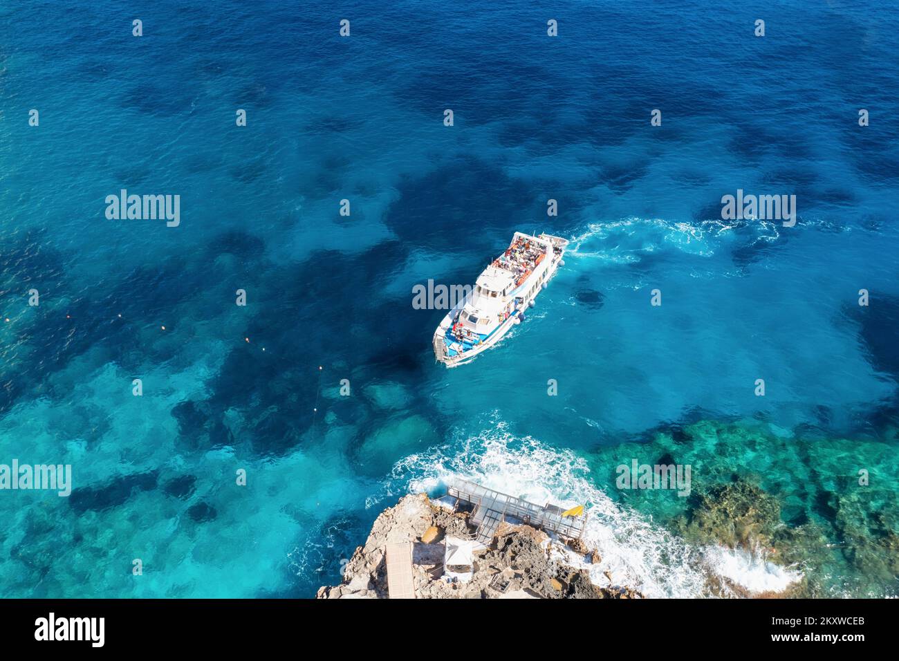 Aerial view seascape with stone dock and ship with tourists top view ...