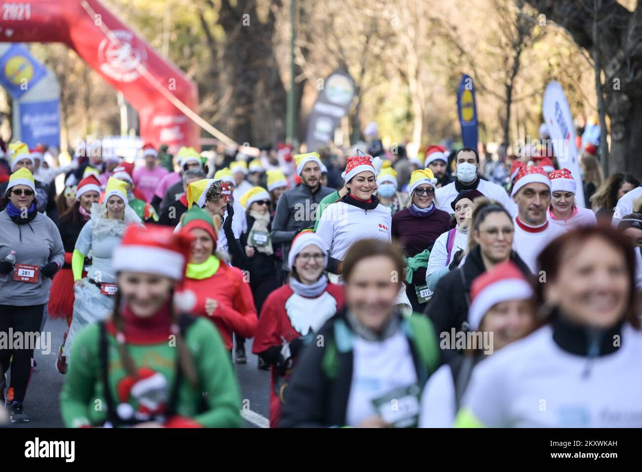 People dressed as Santa Claus take part in a Advent run event in Zagreb ...