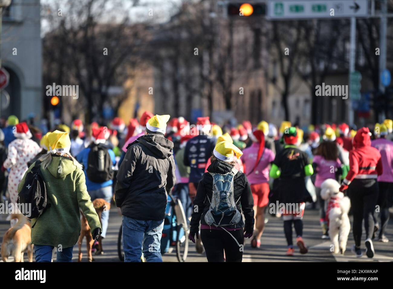 People dressed as Santa Claus take part in a Advent run event in Zagreb ...