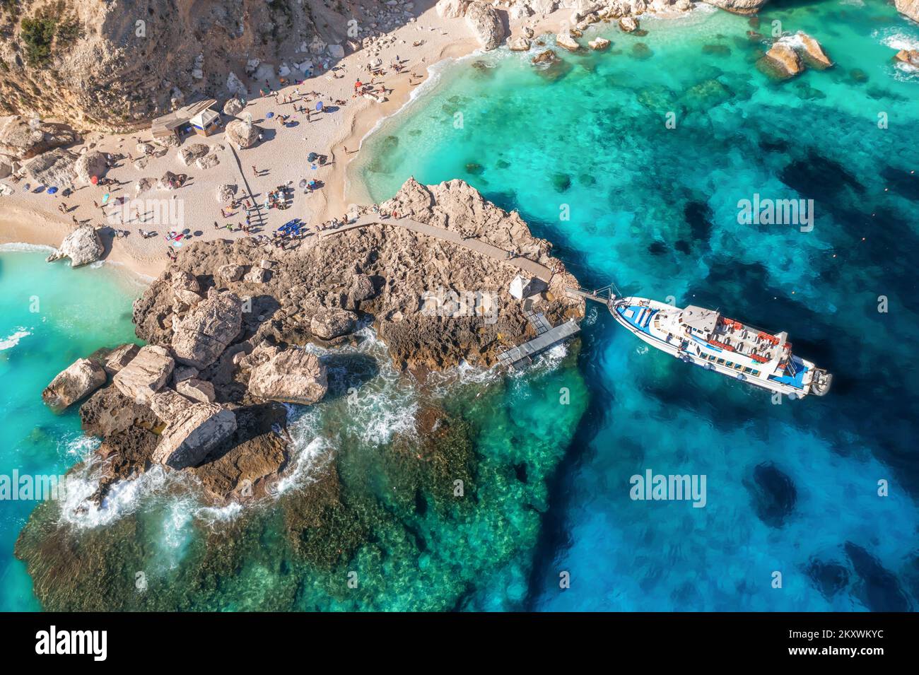 Aerial view beautiful seascape with stone dock, ship with tourists and ...