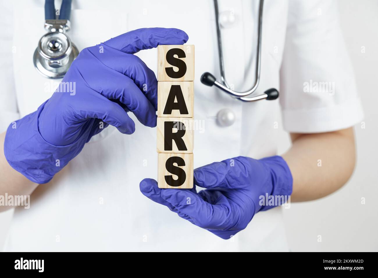 Medicine and health concept. The doctor holds cubes in his hands on ...