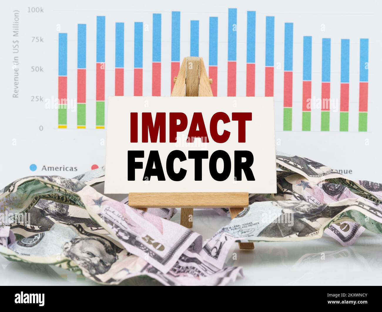 Business and finance concept. Among financial charts and money is a ...