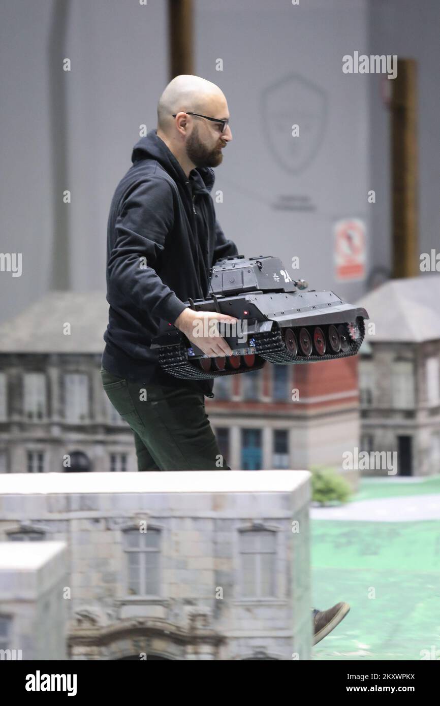 Player holds a tank replica on a battleground in the Iron Bull gameroom ...