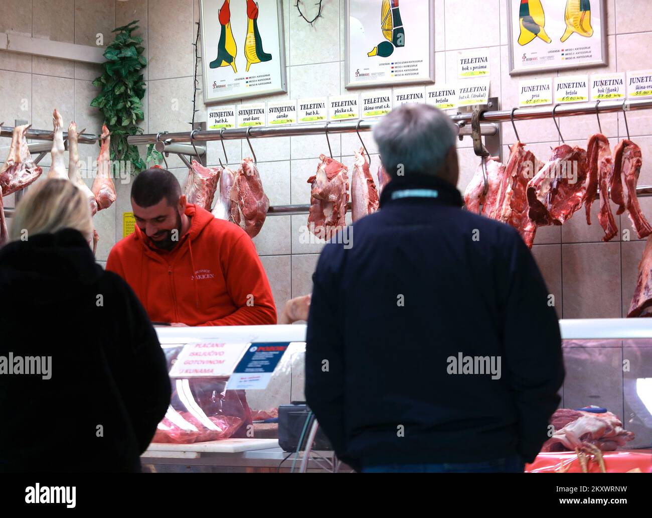 Various meat seen in the butcher shop on the main city market in ...