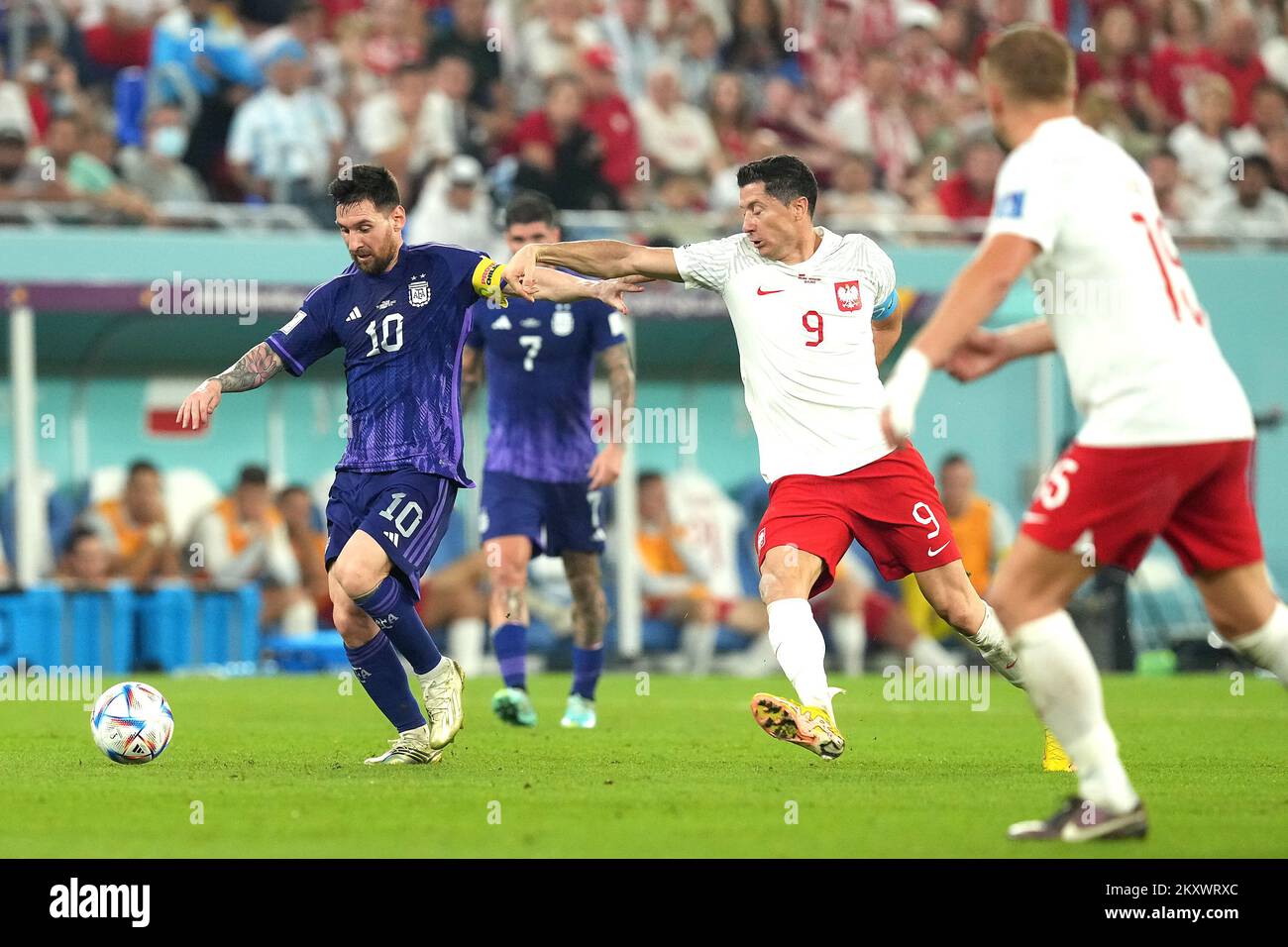 Argentina's Lionel Messi (left) and Poland's Robert Lewandowski battle ...