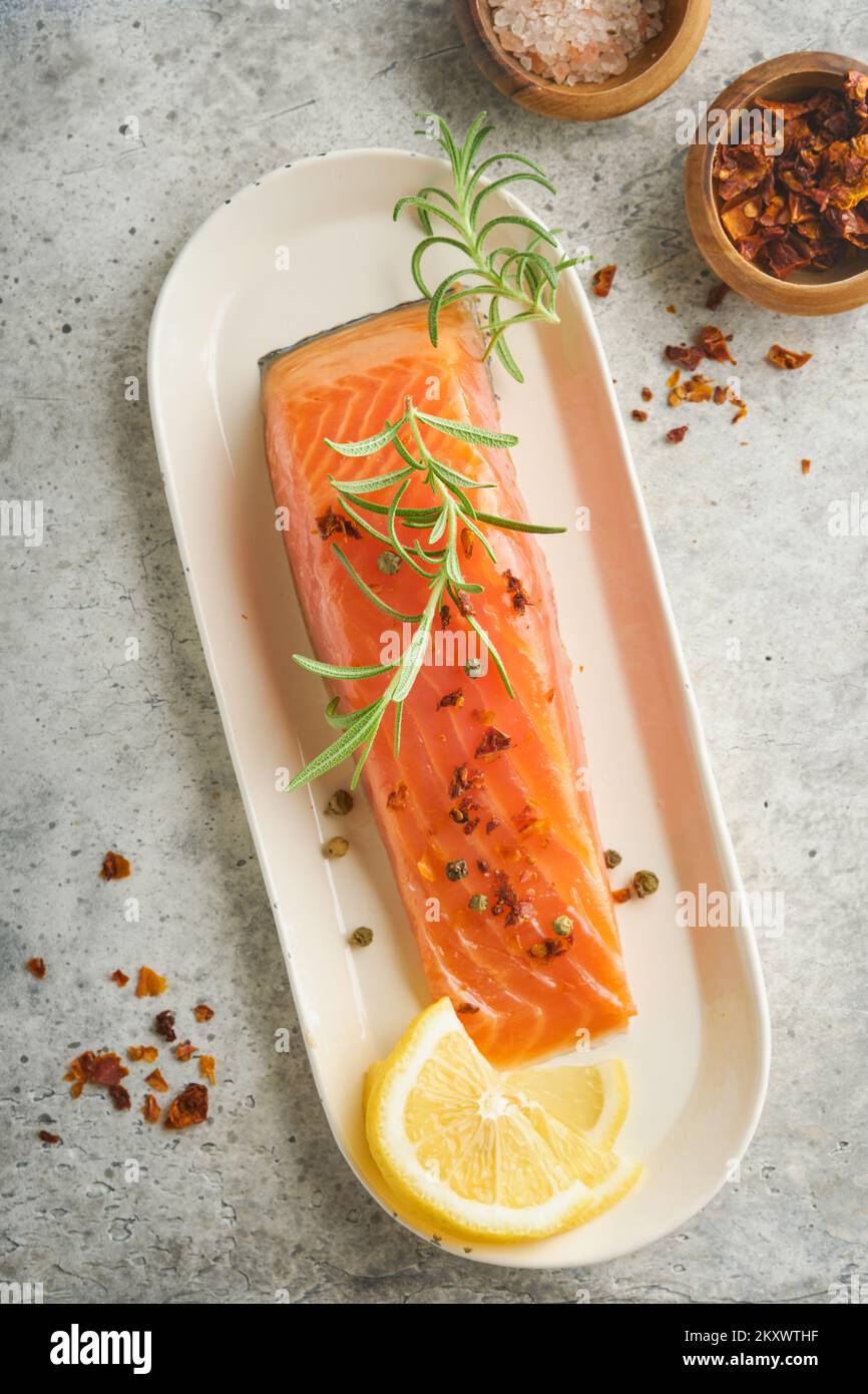 Salmon fish piece. Fresh raw salmon fish piece on marble board stand ...