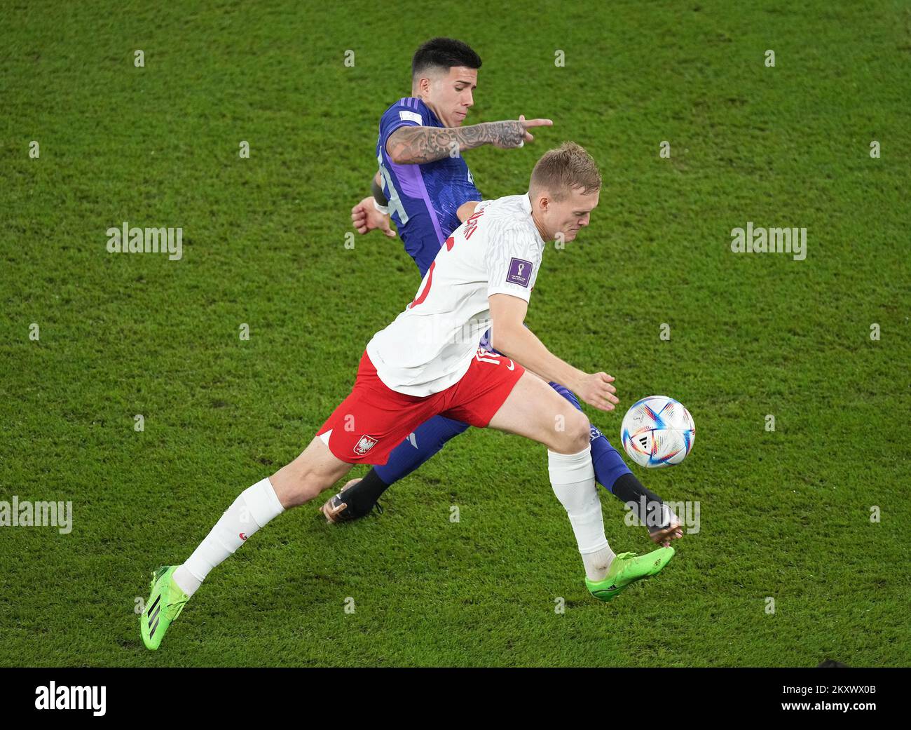 Doha, Qatar. 30th Nov, 2022. Karol Swiderski (R) of Poland vies with ...