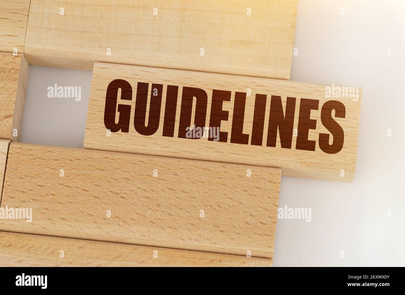 Business and finance concept. There is a wooden Jenga on the table, on ...