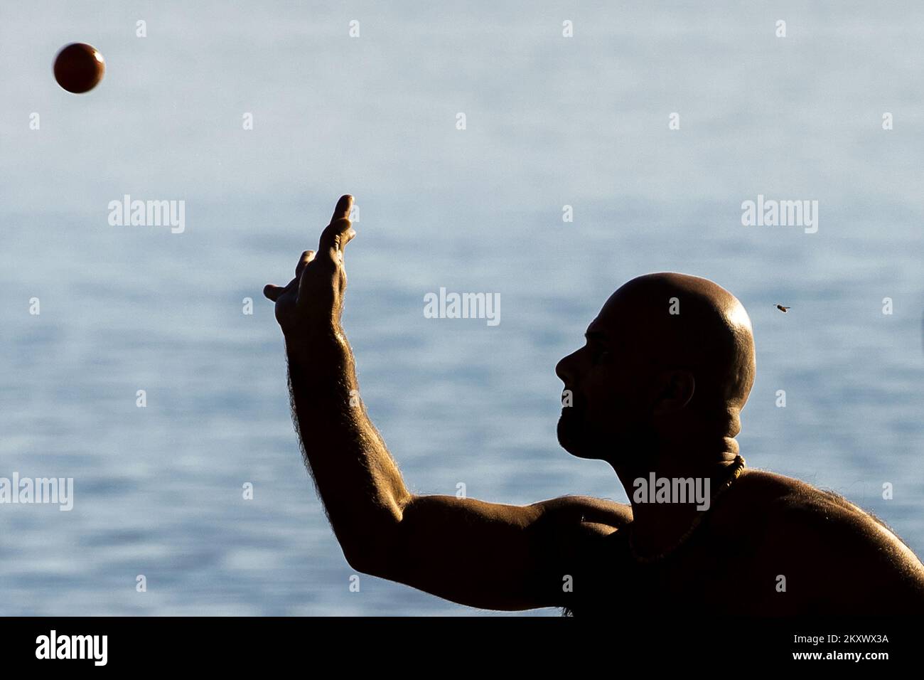 People play a traditional game of picigin during a traditonal Sylvester ...