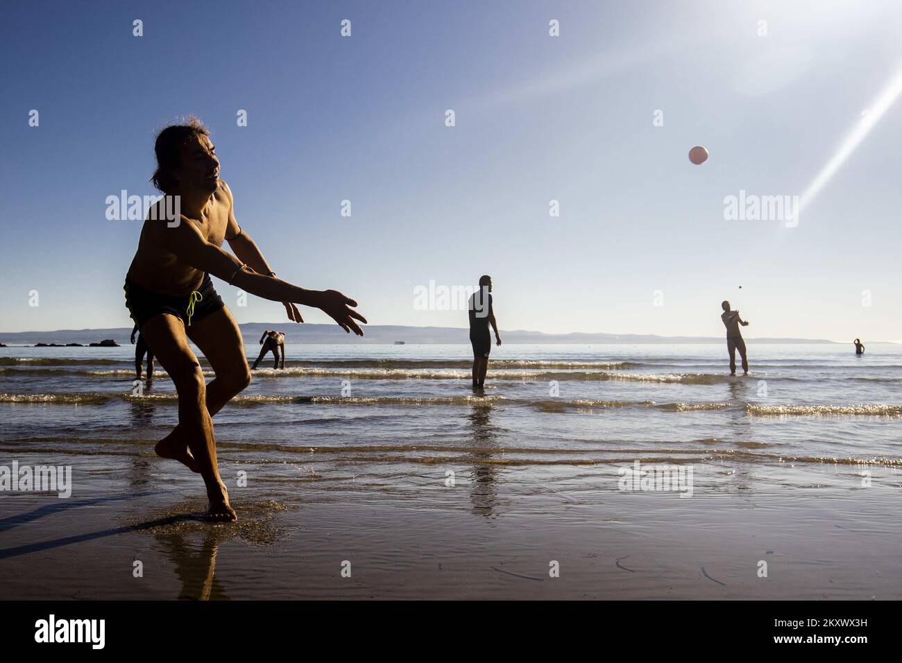 People play a traditional game of picigin during a traditonal Sylvester ...