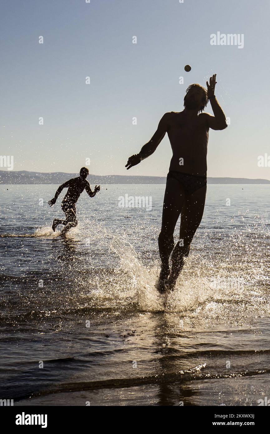 People play a traditional game of picigin during a traditonal Sylvester ...
