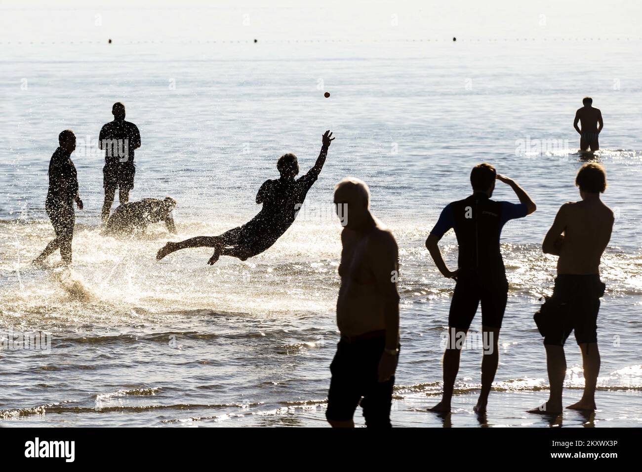 People play a traditional game of picigin during a traditonal Sylvester ...