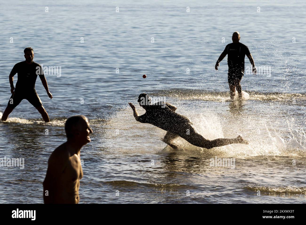 People play a traditional game of picigin during a traditonal Sylvester ...
