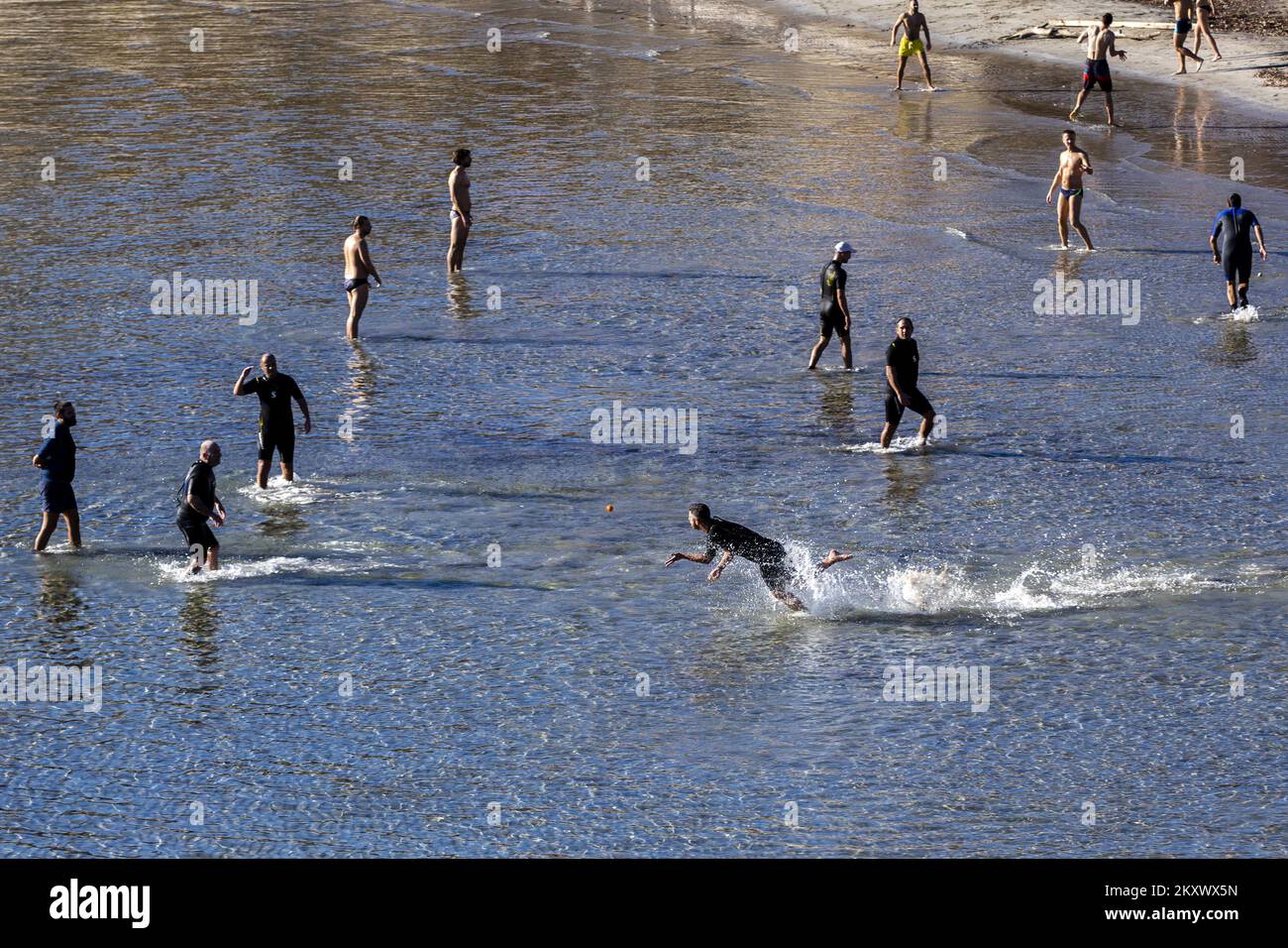 People play a traditional game of picigin during a traditonal Sylvester ...