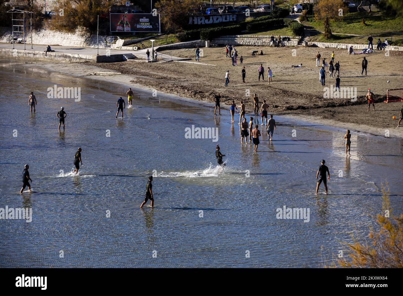 People play a traditional game of picigin during a traditonal Sylvester ...