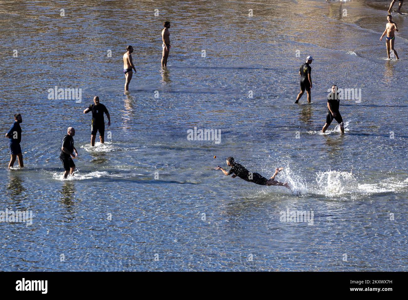 People play a traditional game of picigin during a traditonal Sylvester ...