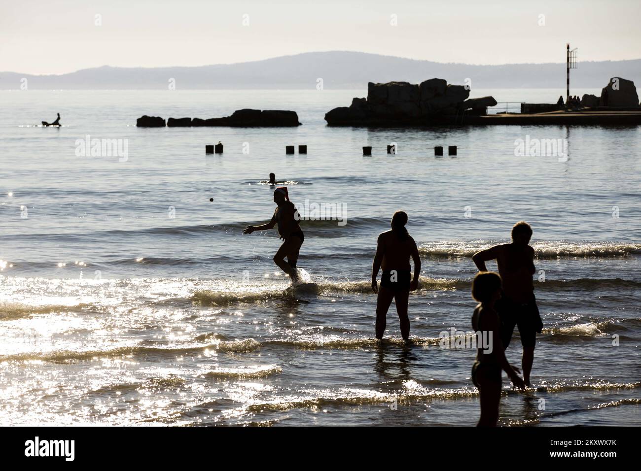 People play a traditional game of picigin during a traditonal Sylvester ...