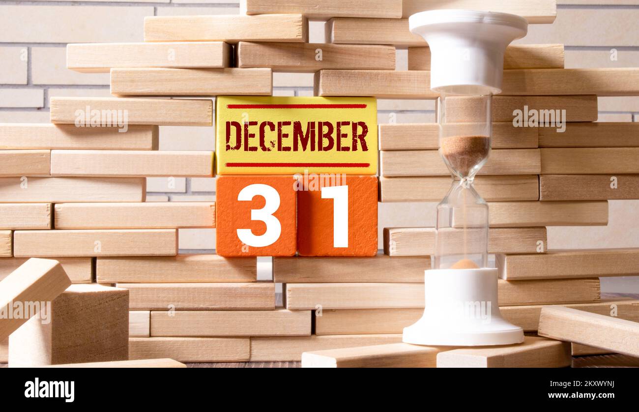December 31st. Day 31 of December set on wooden calendar with bokeh ...
