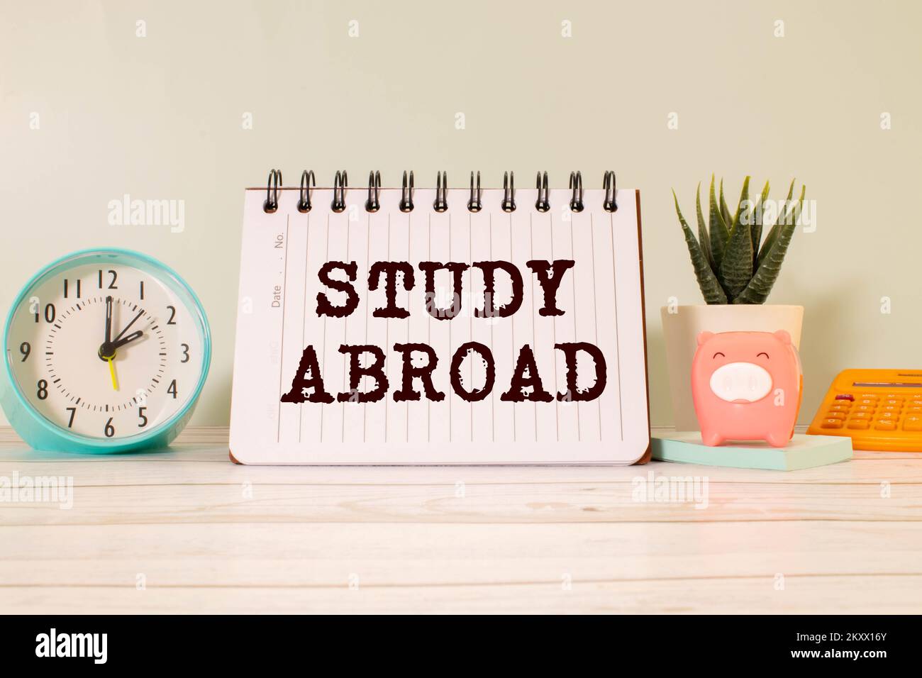 Study Abroad. text on yellow sticker on notepad Stock Photo - Alamy