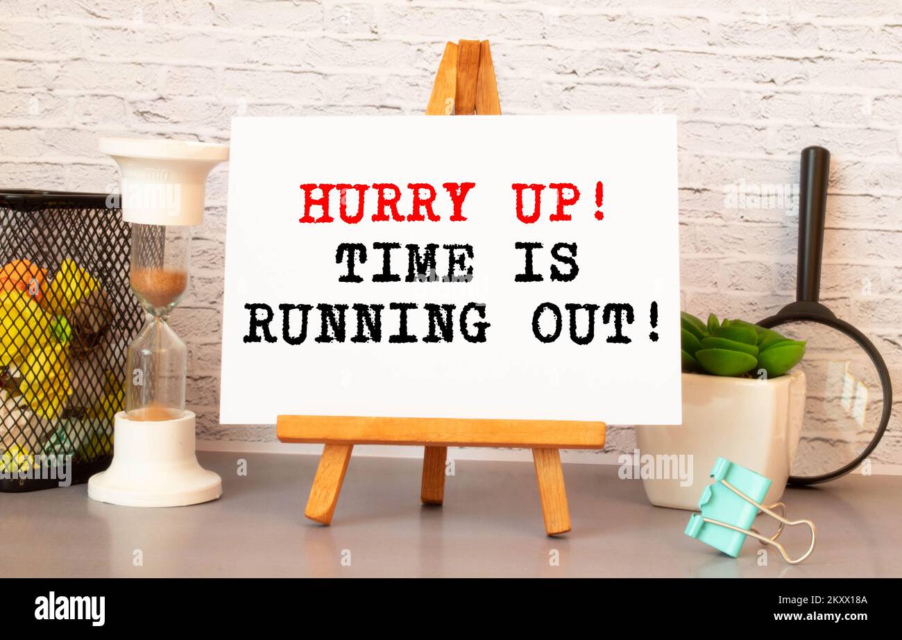 Time is running, text on notepad with clock on white background Stock ...