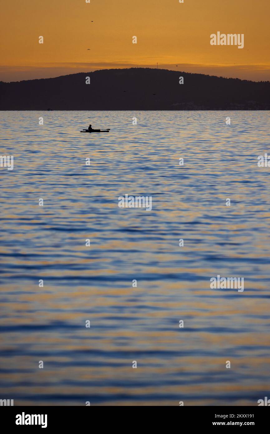 The sunset lights up the sky in Split, Croatia on January 7, 2022 ...