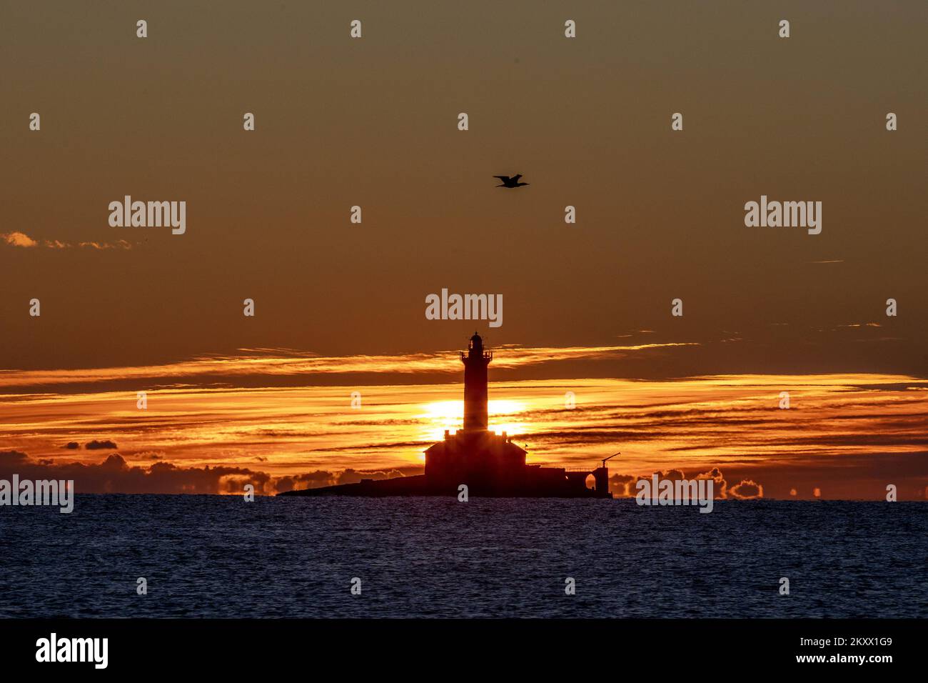 Photo taken on January 07, 2022 shows the Porer lighthouse at sunset ...