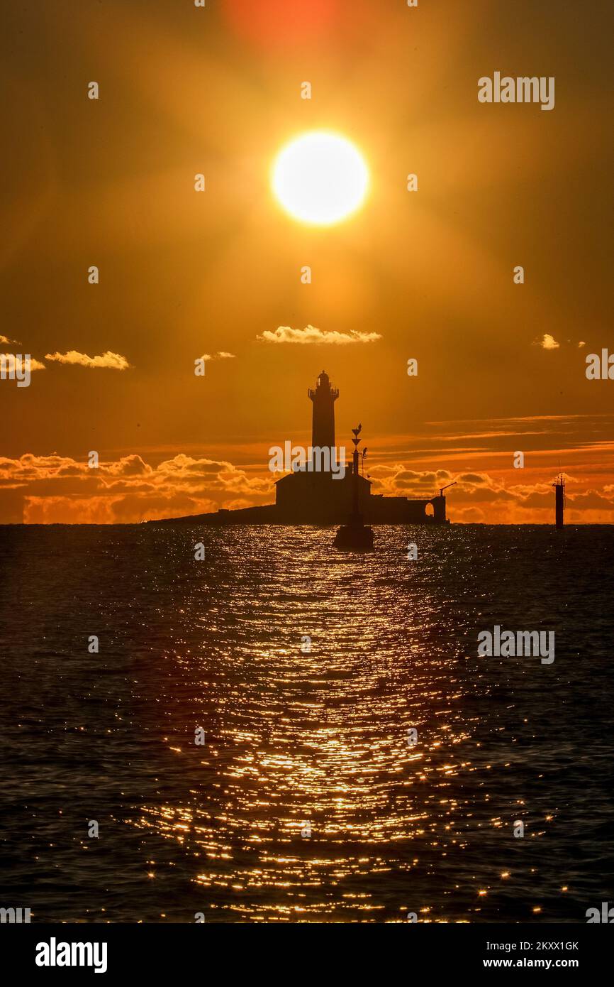 Photo taken on January 07, 2022 shows the Porer lighthouse at sunset ...