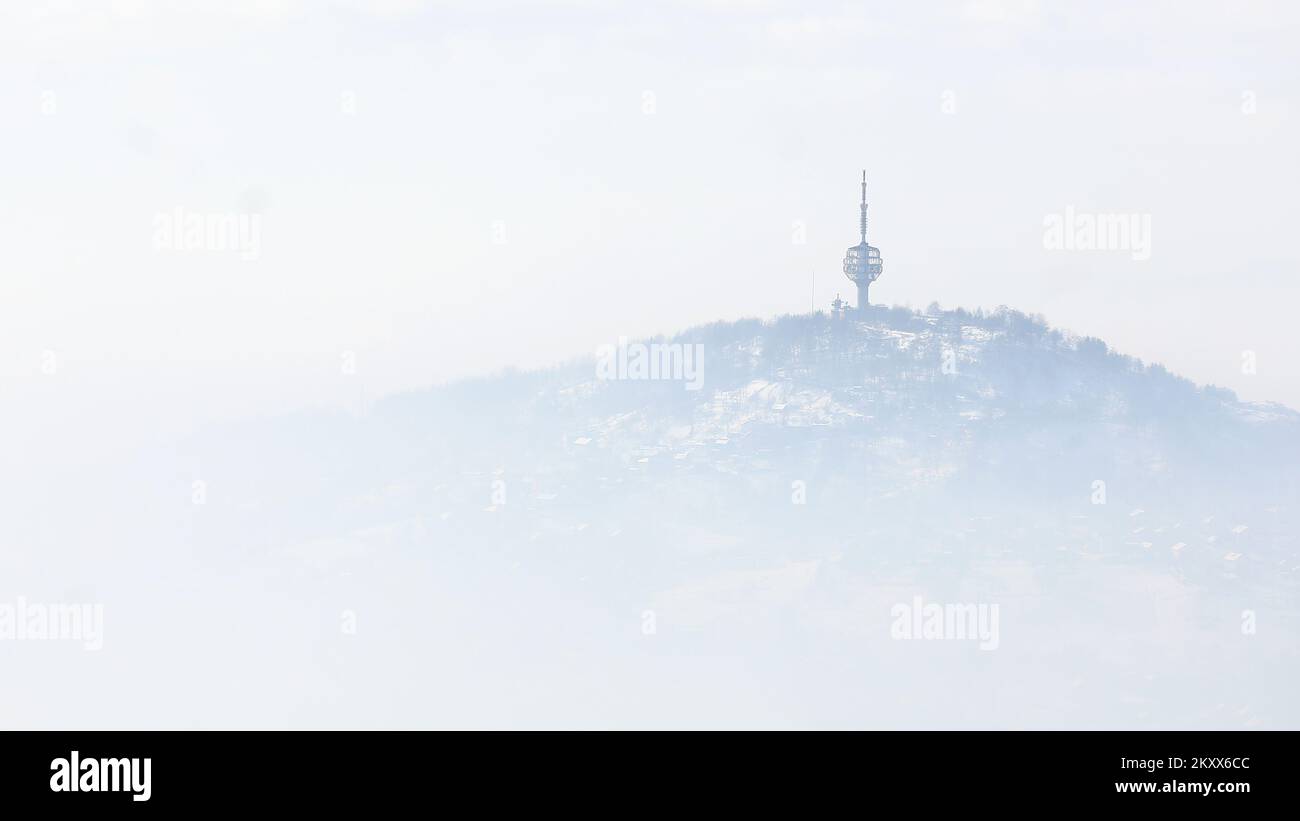 Hum antenna tower breaks through fog and smog in Sarajevo, Bosnia and ...