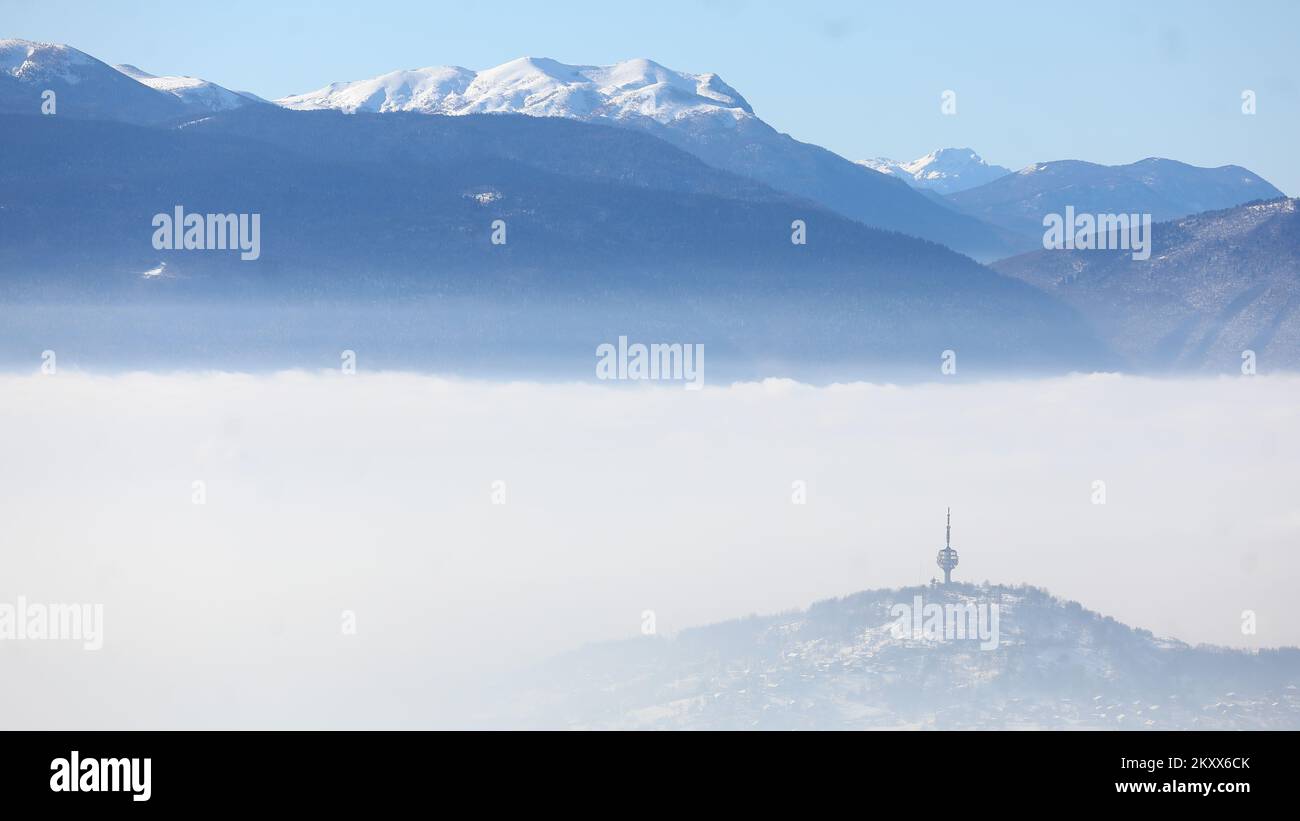 Hum antenna tower breaks through fog and smog in Sarajevo, Bosnia and ...