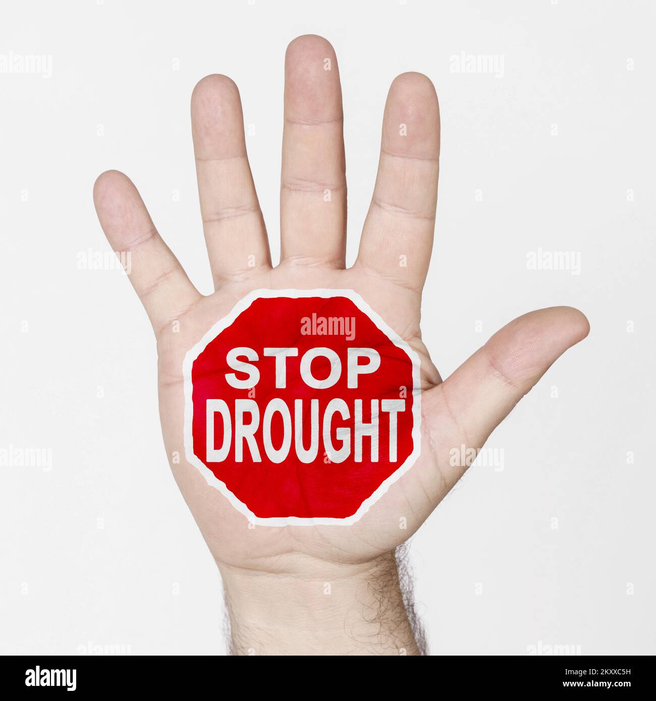 On the palm of the hand there is a stop sign with the inscription ...