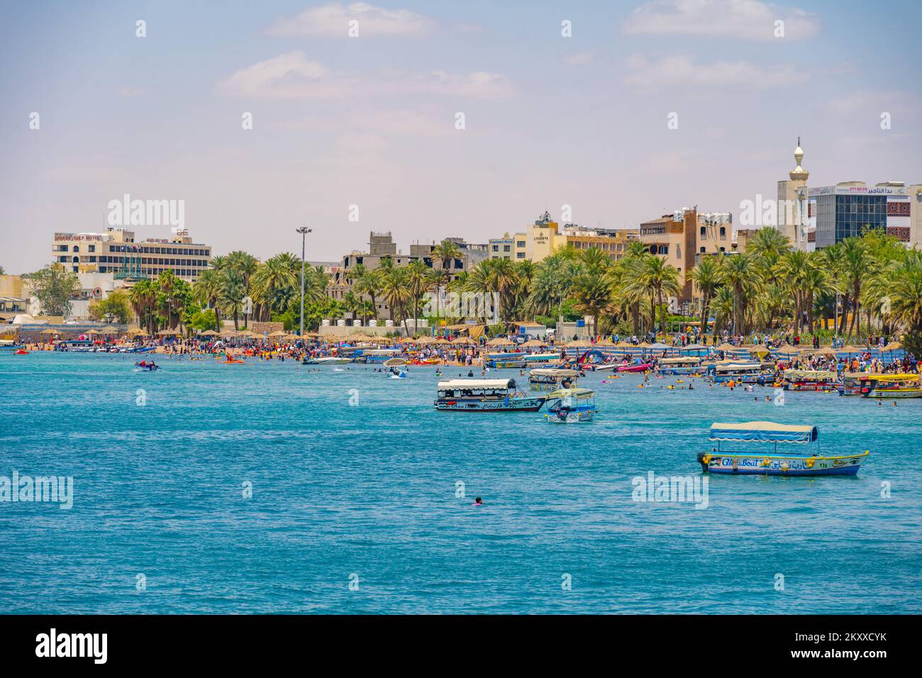Tourist boats off the public beaches at Aqaba from the Red Sea Stock ...