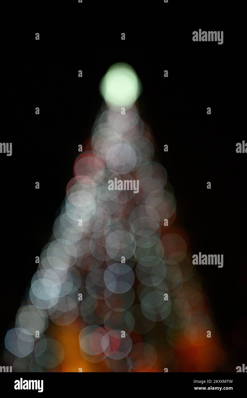 Christmas tree with lights glowing Stock Photo - Alamy