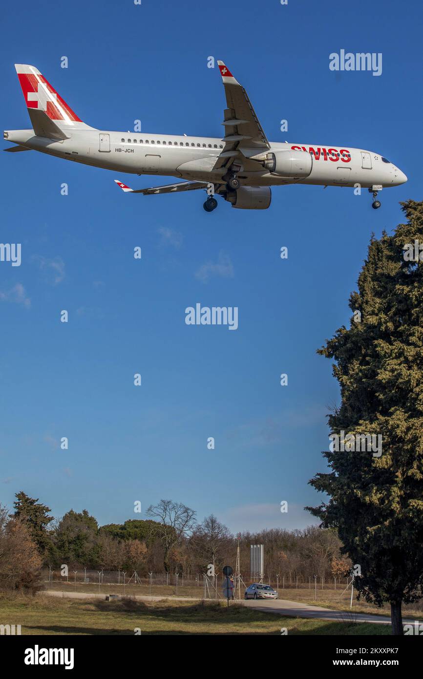 Airbus A220-300 fly over Pula, Croatia, on February 02, 2022. For years ...