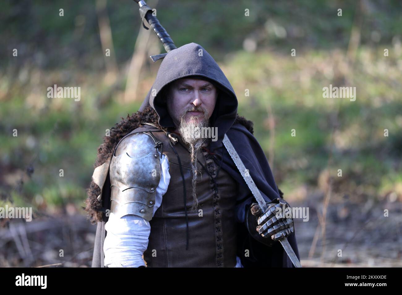 A Locals dressed in medieval clothes participates in a re-enactment of ...