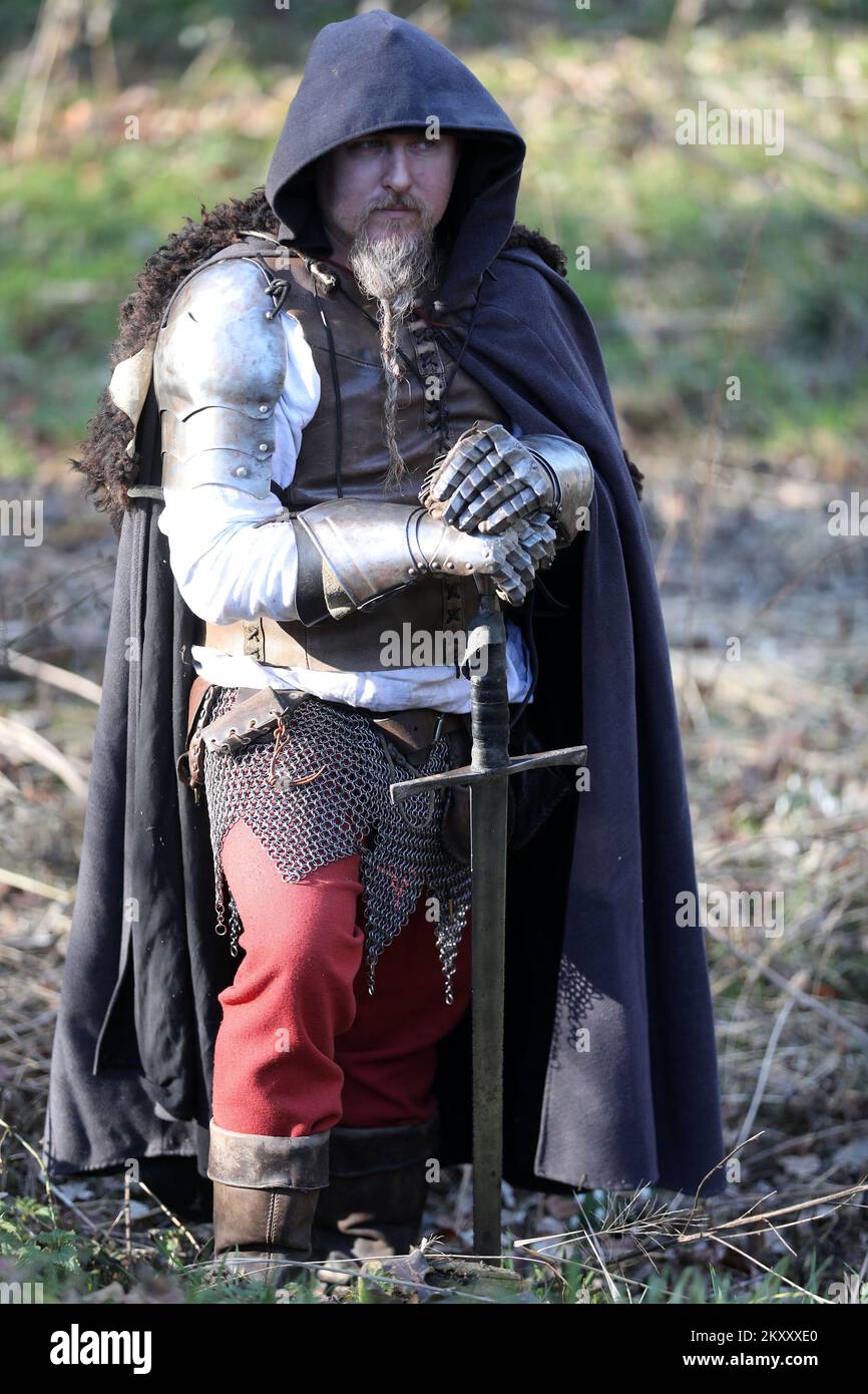 A Locals dressed in medieval clothes participates in a re-enactment of ...