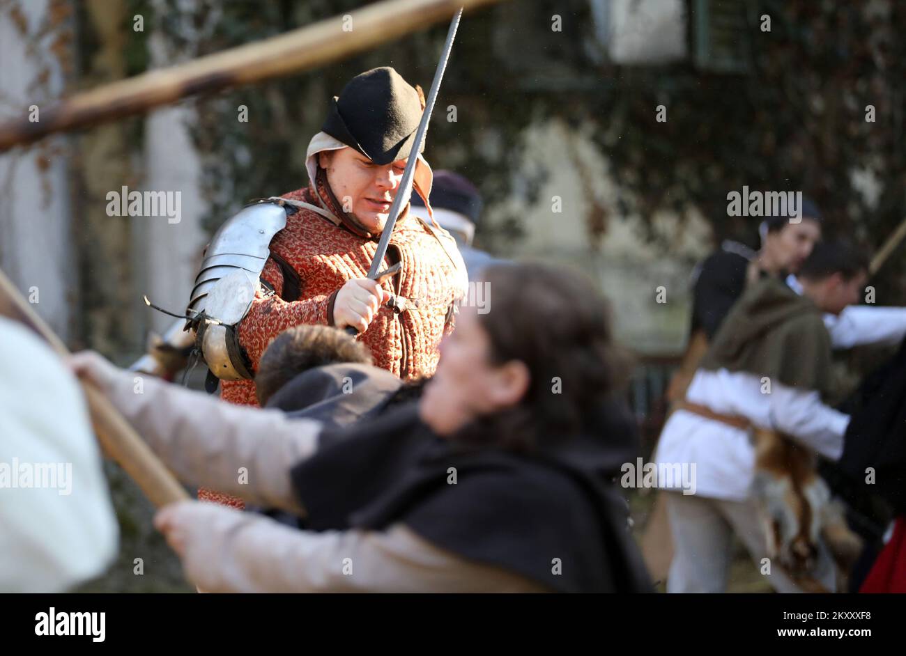 A Locals dressed in medieval clothes participates in a re-enactment of ...