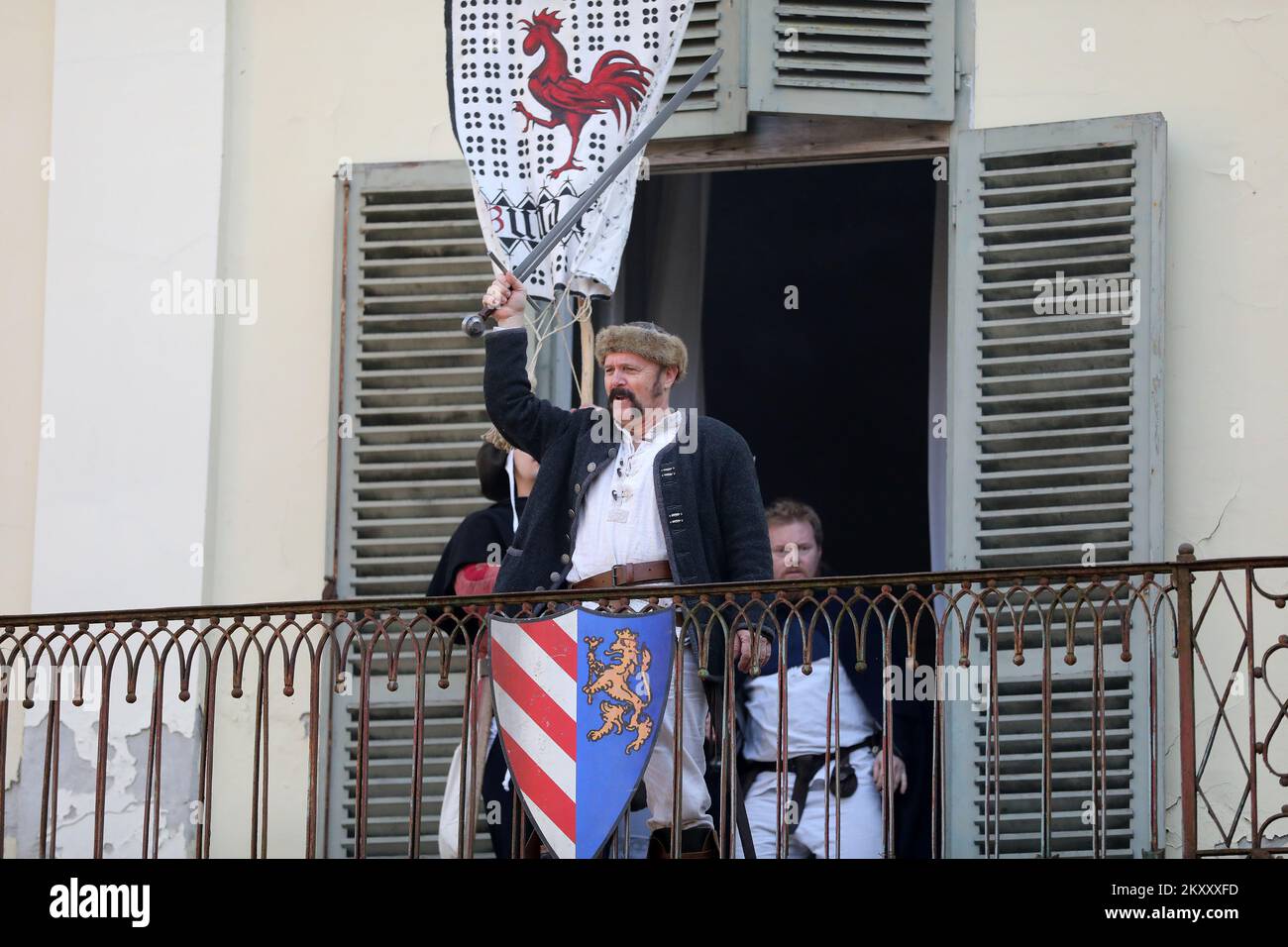 A Locals dressed in medieval clothes participates in a re-enactment of ...